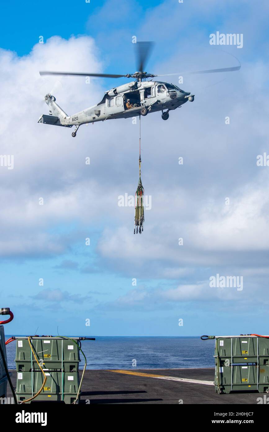 211011-N-DW158-1003 PACIFIC OCEAN (Oct. 11, 2021) An MH-60S Sea Hawk ...