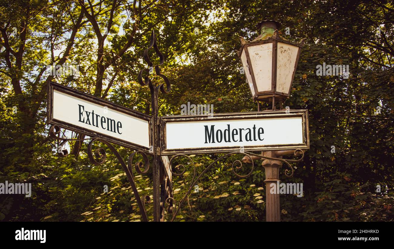 Street Sign the Direction Way to Moderate versus Extreme Stock Photo ...