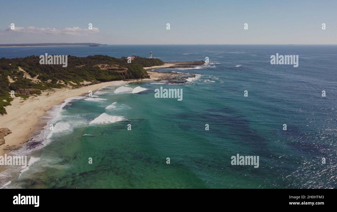 high aerial view of norah head lighthouse and pebbly beach Stock Photo ...