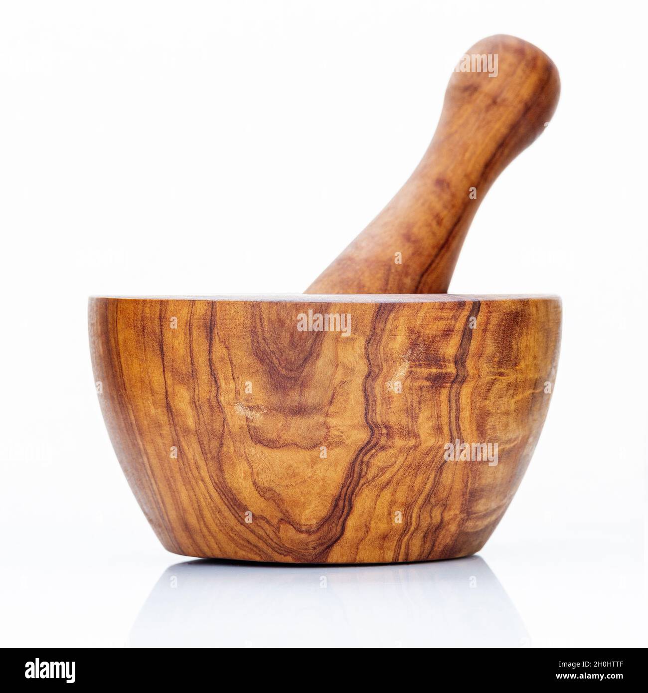 Closeup handmade wooden mortar and pestle isolated on white background ...