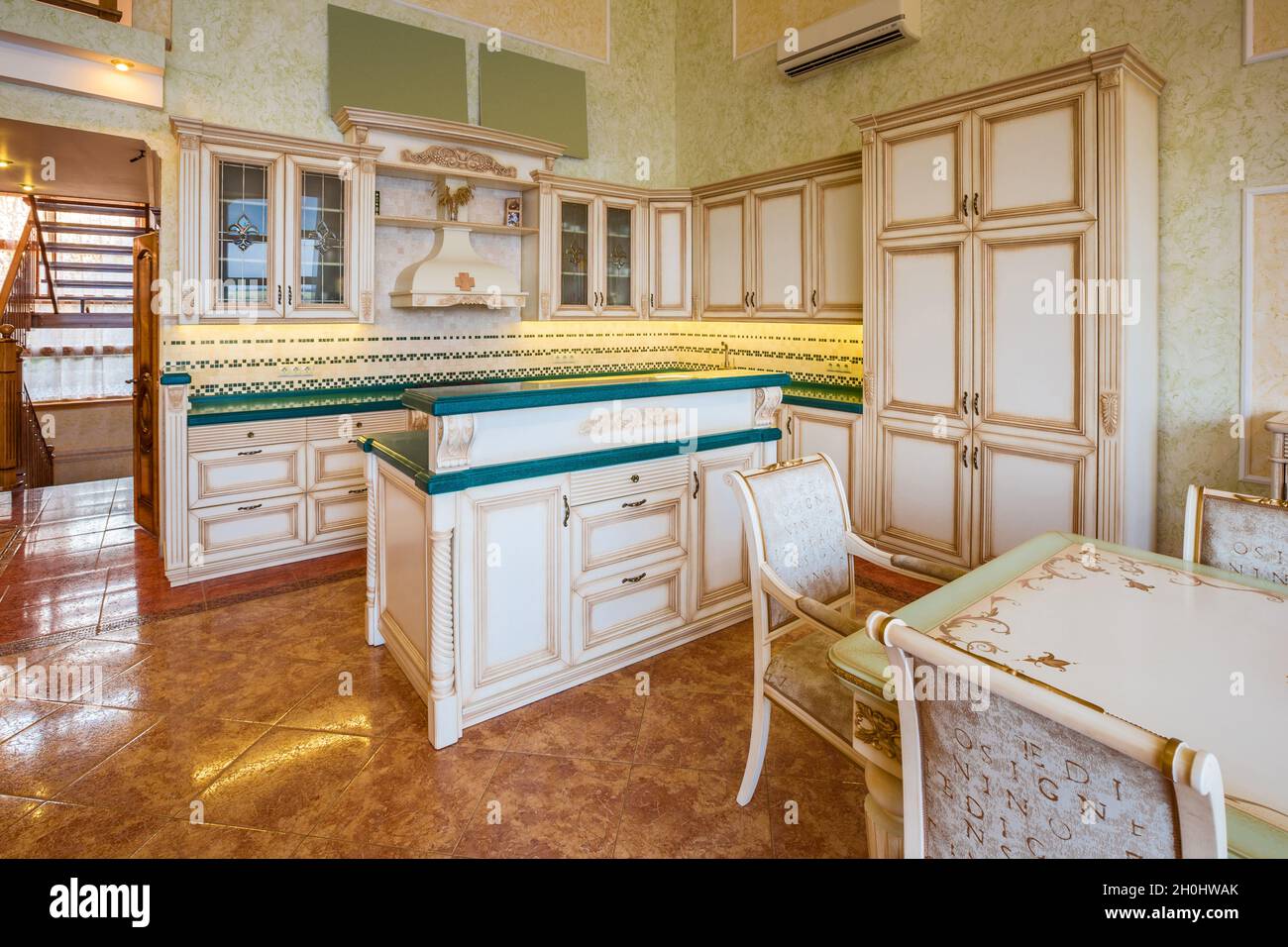 Interior design of a luxury modern kitchen with the counter and some ...