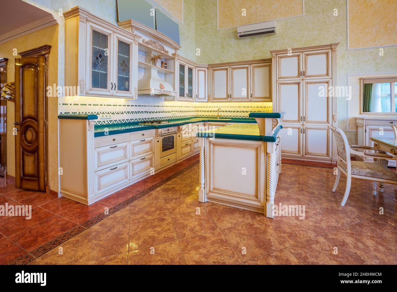 Interior design of a luxury modern kitchen with the counter and some ...