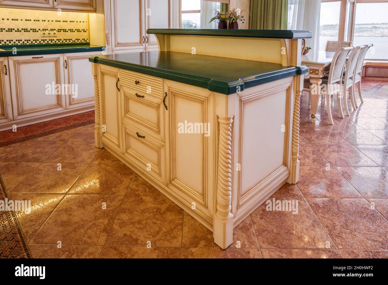 Interior design of a luxury modern kitchen with the counter and some ...