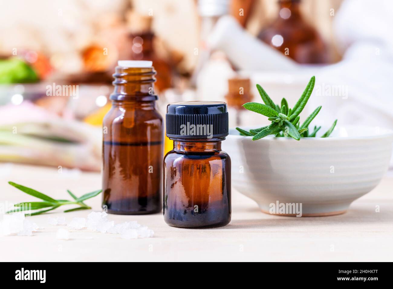 Fresh rosemary and essential oil with shallow depth of field setup on ...
