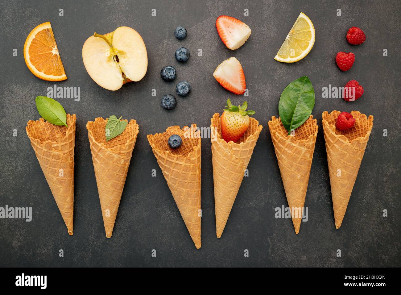Various of fruits in cones blueberry ,strawberry ,raspberries and ...
