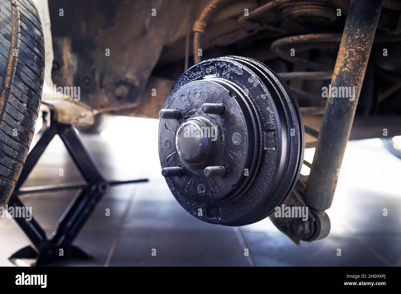 A rear hub of the car after removing a tire and wheel, maintaining a ...