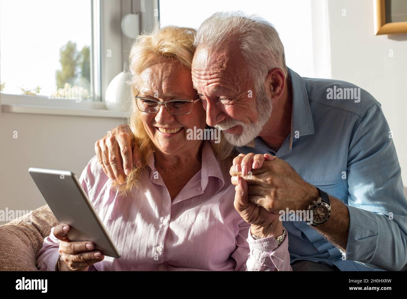 Modern elderly people using tablet hi-res stock photography and images ...