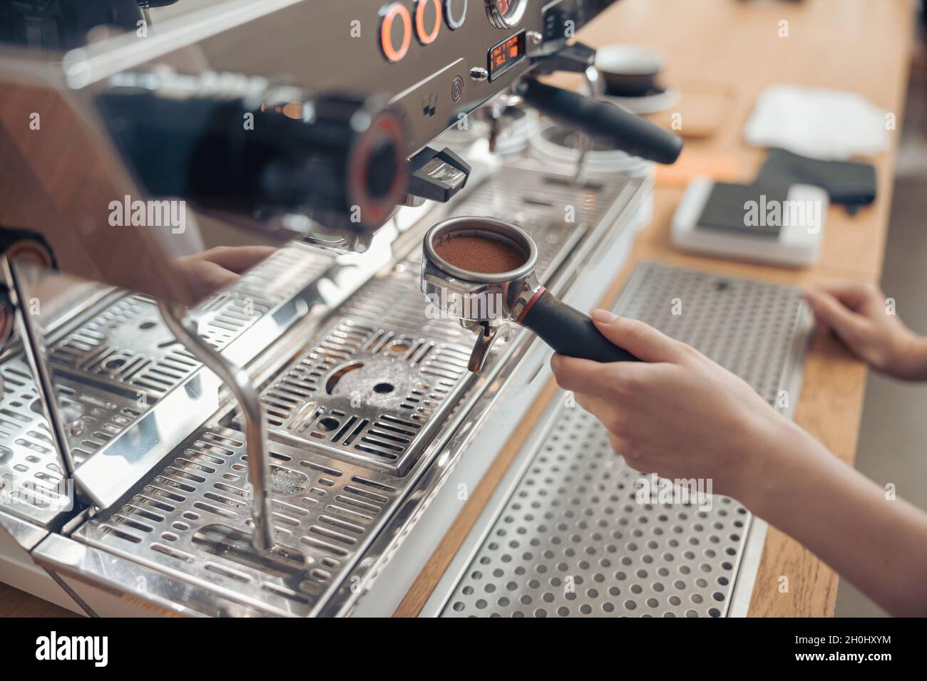 Female barista using modern coffee machine in cafeteria Stock Photo - Alamy