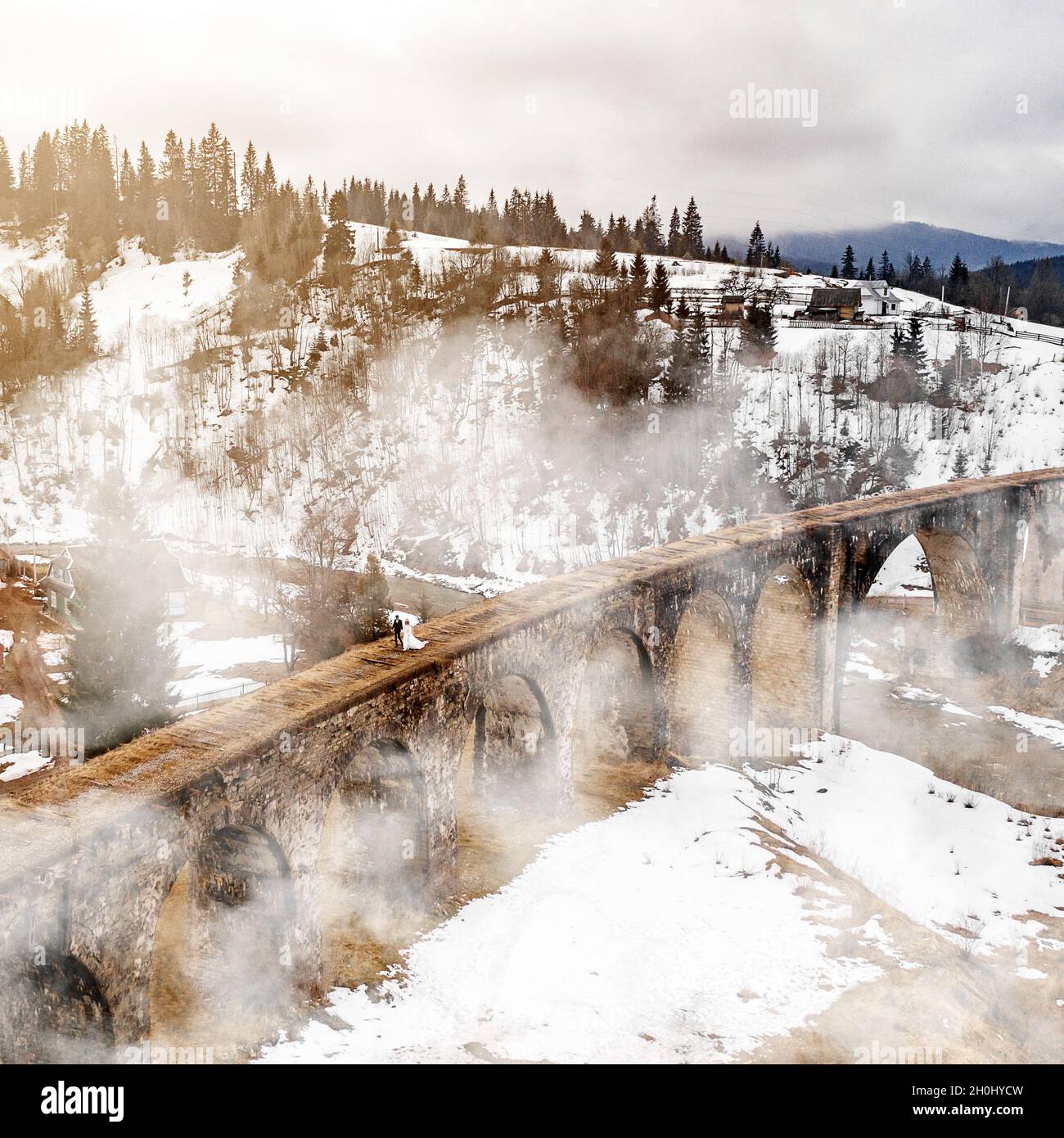 Vorokhta, Ukraine March 31, 2021: Walk along the old viaduct bridge ...