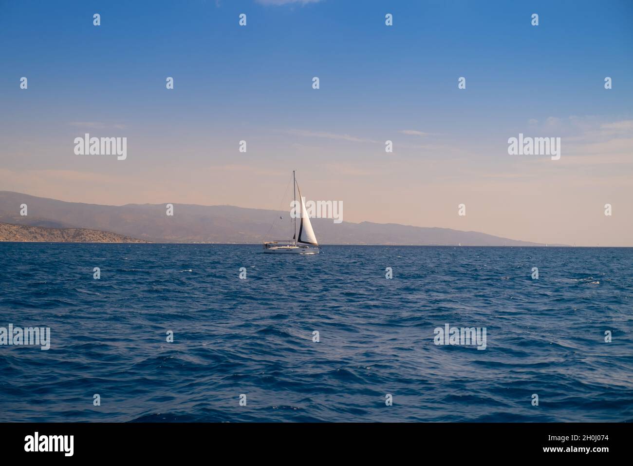 Catamaran sail Yacht cruising on deep blue sea water Stock Photo - Alamy
