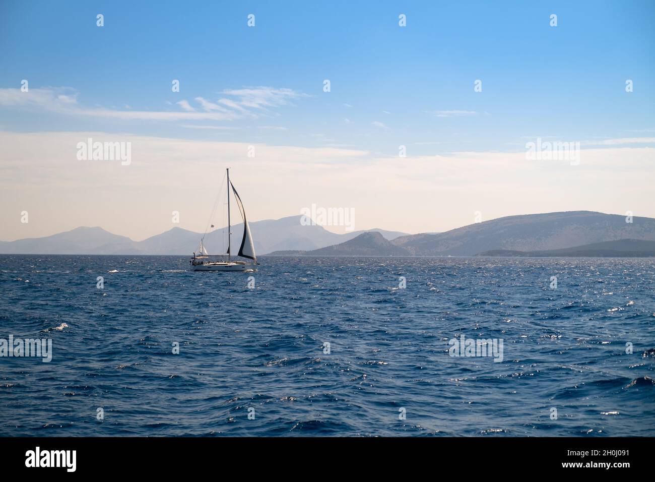 Catamaran sail Yacht cruising on deep blue sea water Stock Photo - Alamy