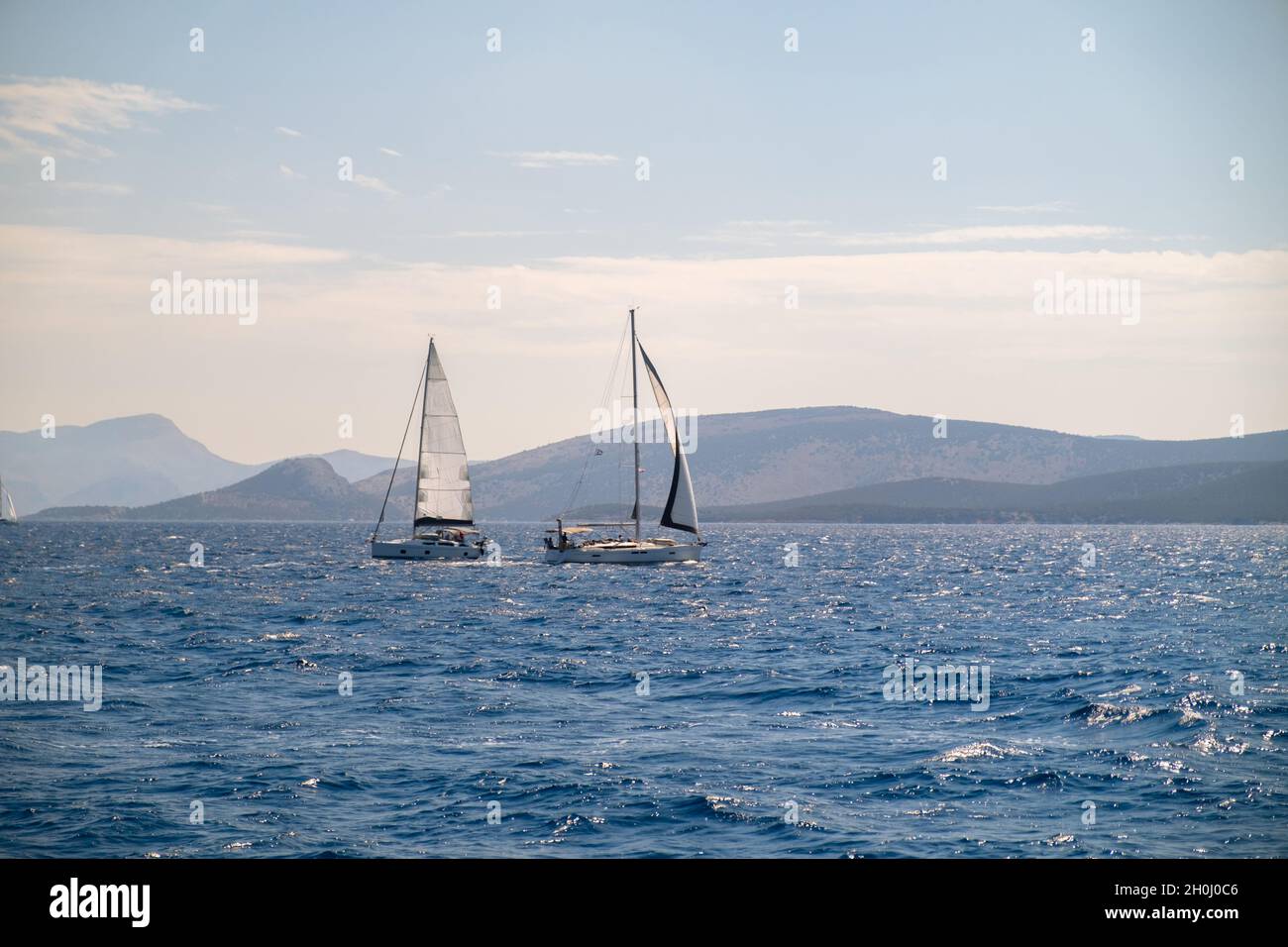 Catamaran sail Yacht cruising on deep blue sea water Stock Photo - Alamy