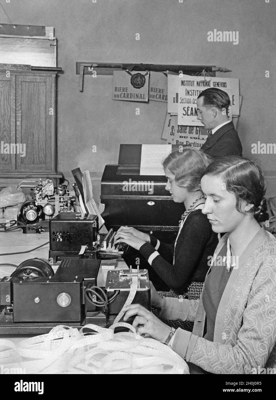 Telegraph Union typists at the teleprinter transcribing messages ...