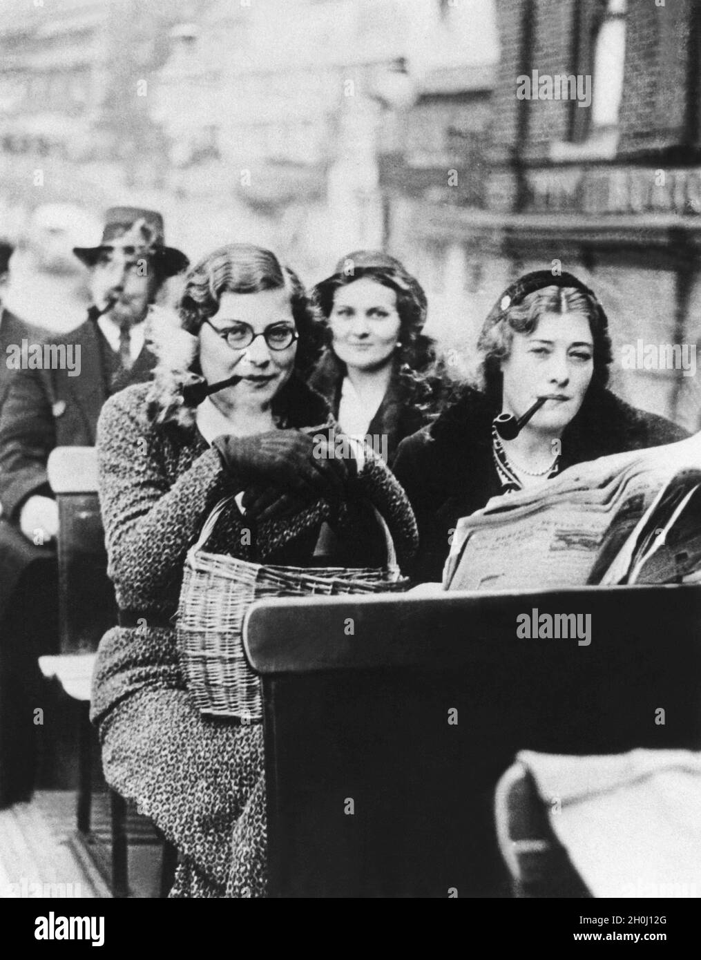 Smoking women on a bus in England. [automated translation] Stock Photo ...