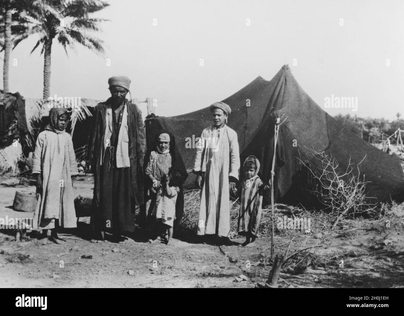 Bedouin family in front of their tent in the Baghdad area. Undated photograph. [automated ...