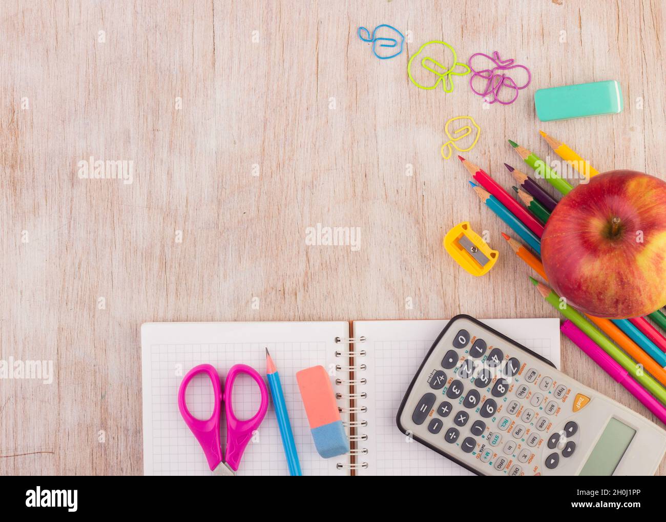 Top view of school supplies on wooden desk. Place for your text Stock ...