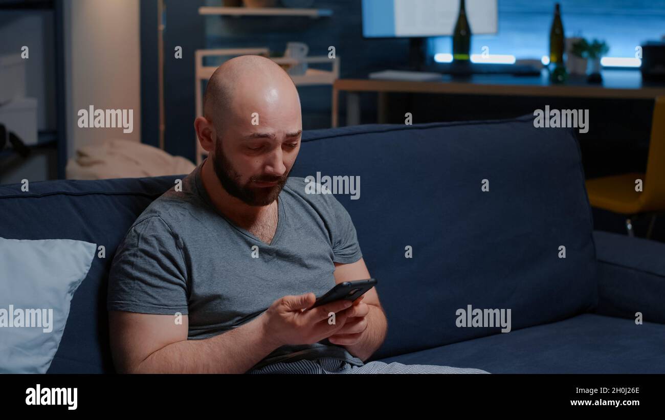Surprised overdue man receiving bad news from bank, having nervous ...