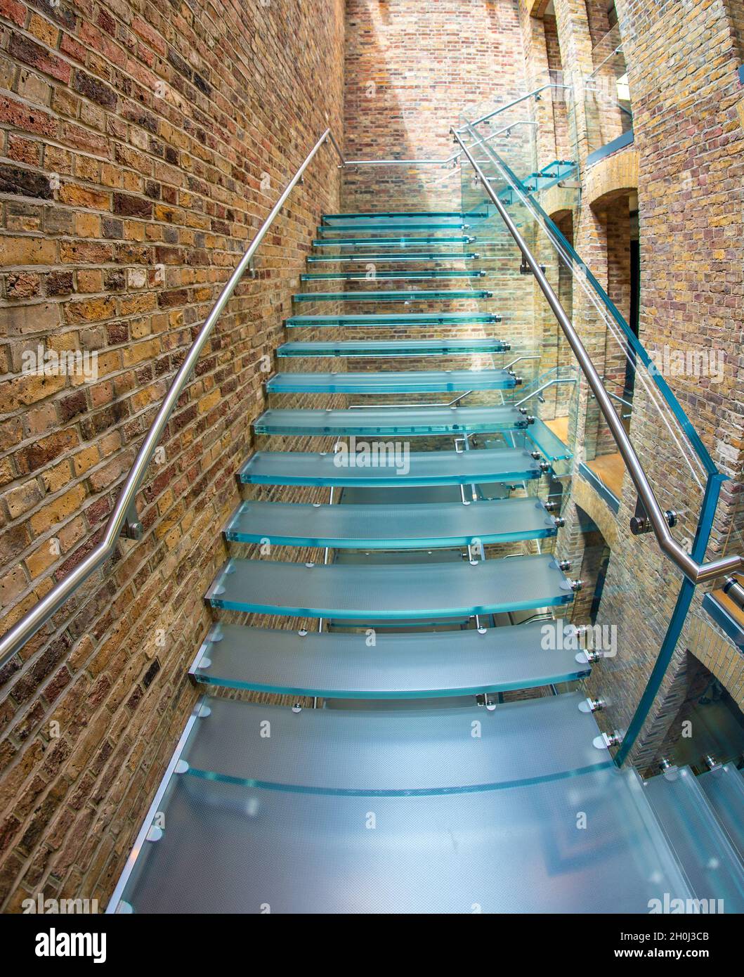 Modern transparent stairs, upward view. Business and corporate concept ...