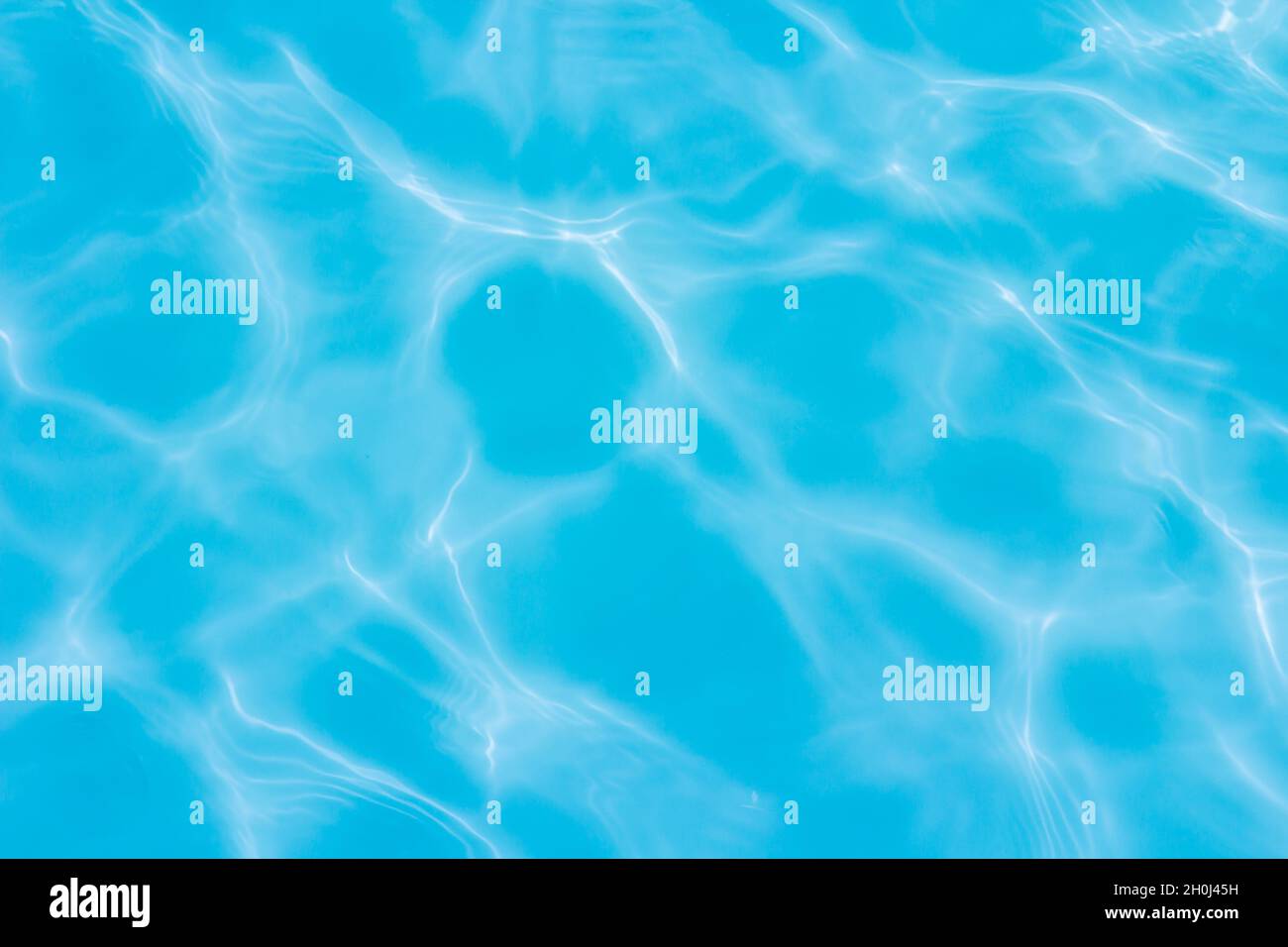 swimming pool with sunny reflections background Stock Photo - Alamy