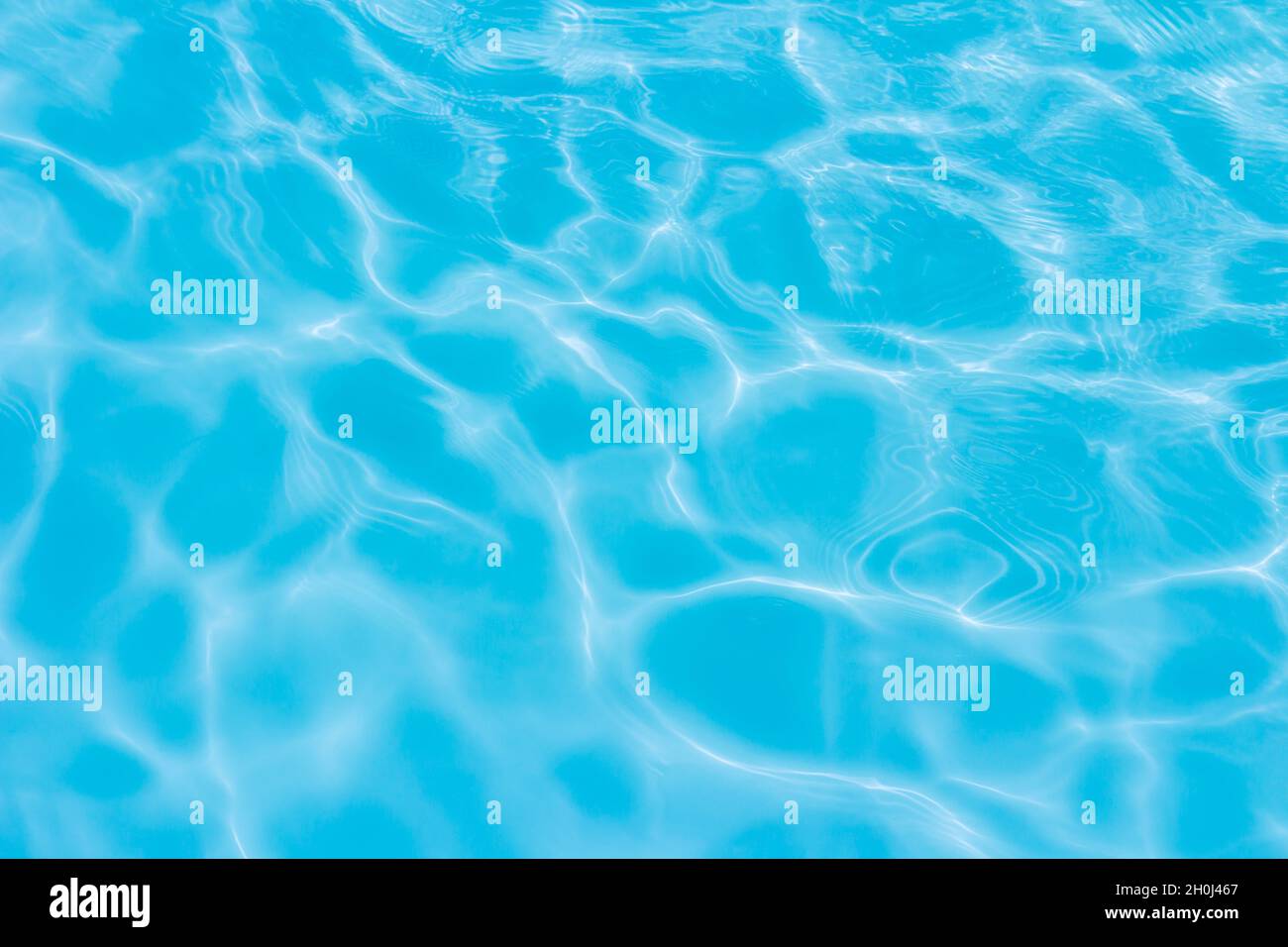 swimming pool with sunny reflections background Stock Photo - Alamy