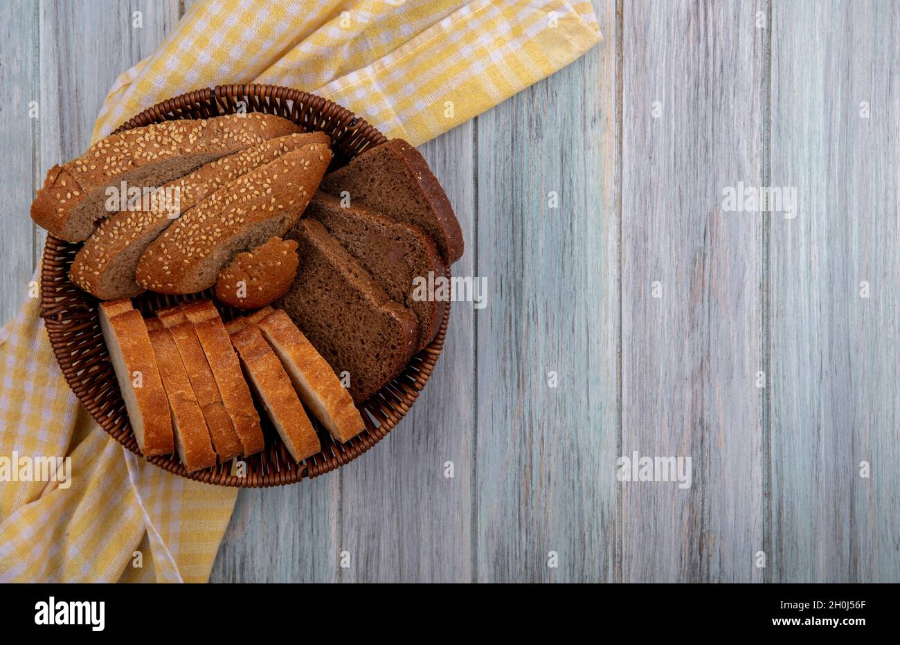 top view of breads as sliced seeded brown cob rye and crusty ones in ...