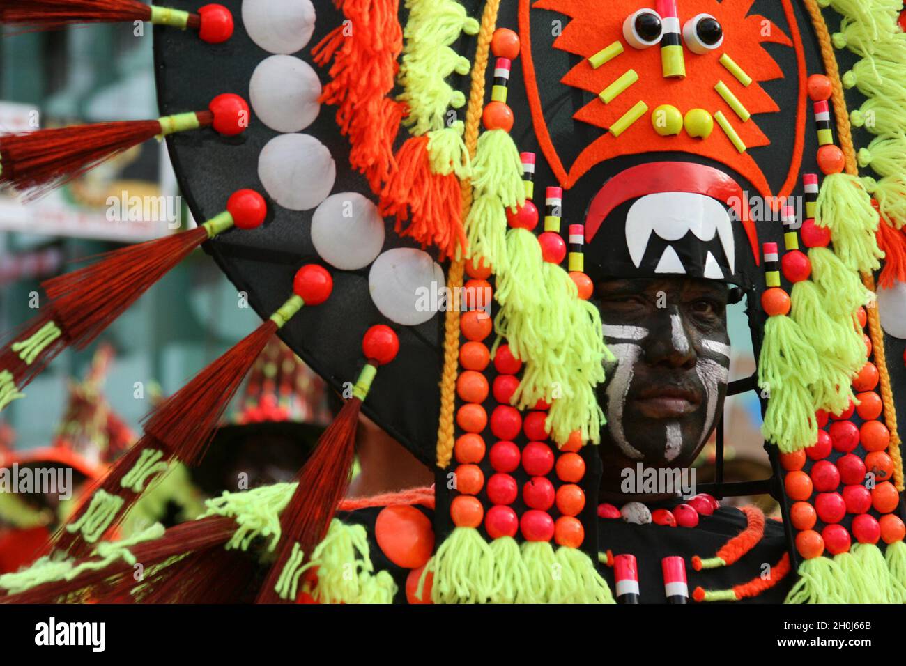 A man wearing his costume during the Ati-Atihan Festival in Aklan, West ...
