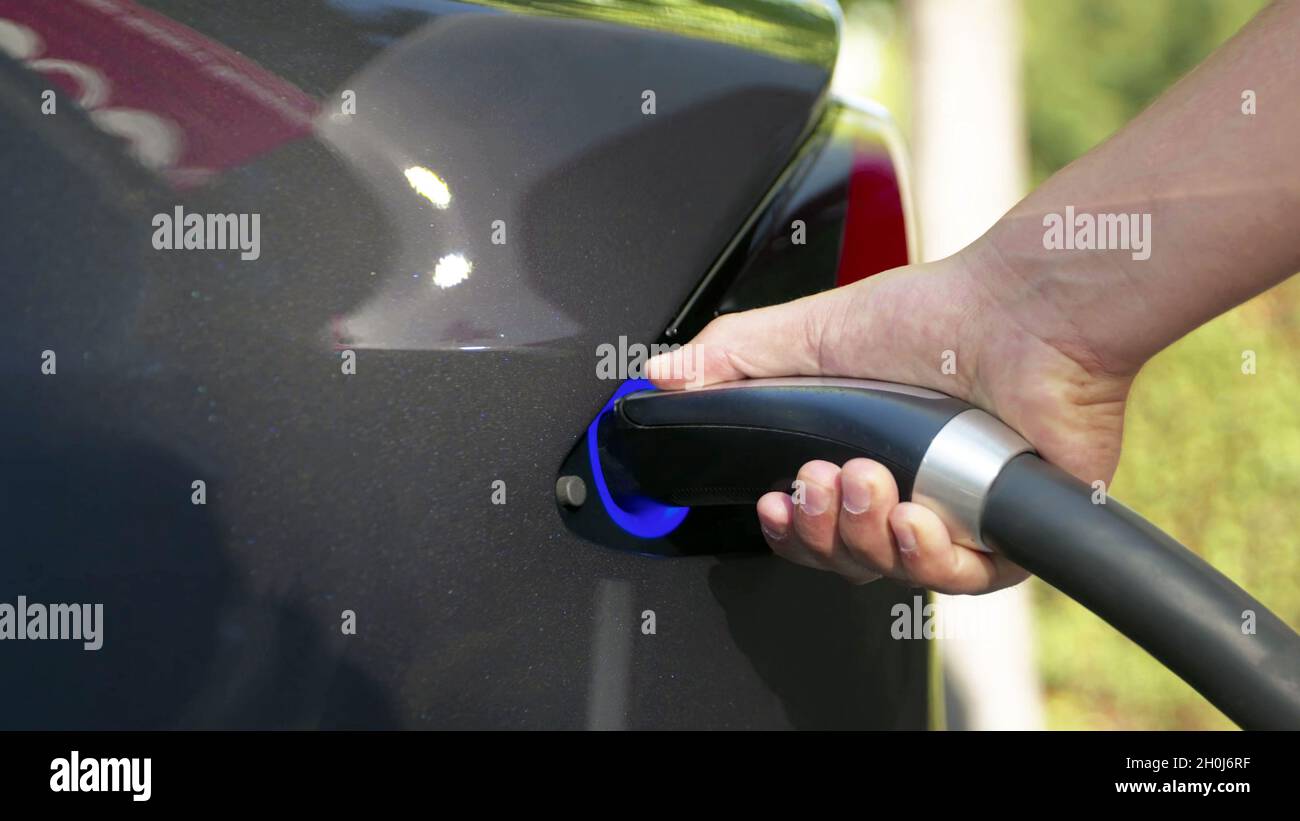 Electric vehicle charger arm hi-res stock photography and images - Alamy