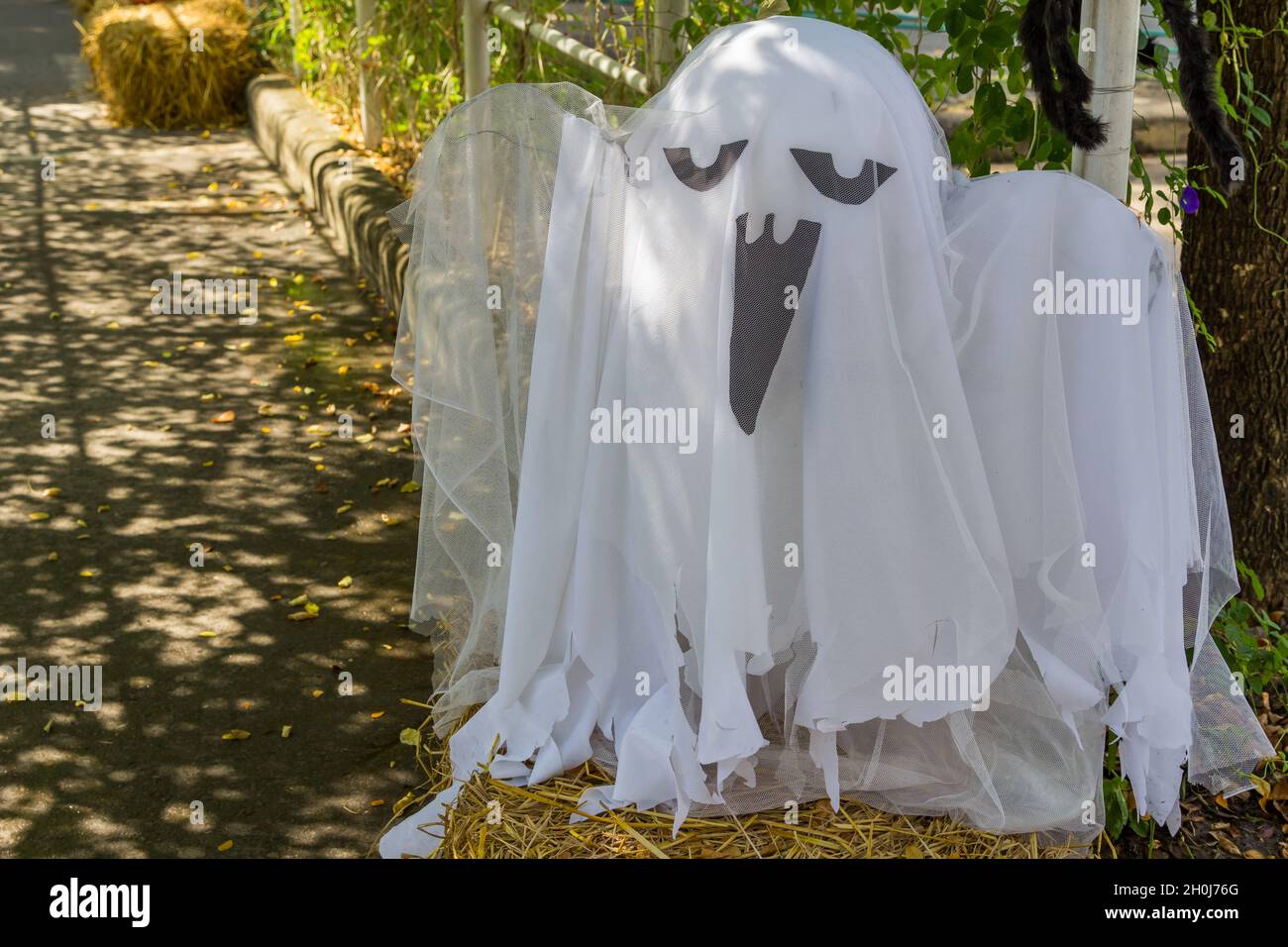 cute white fabric ghost doll on rice straw background Stock Photo - Alamy