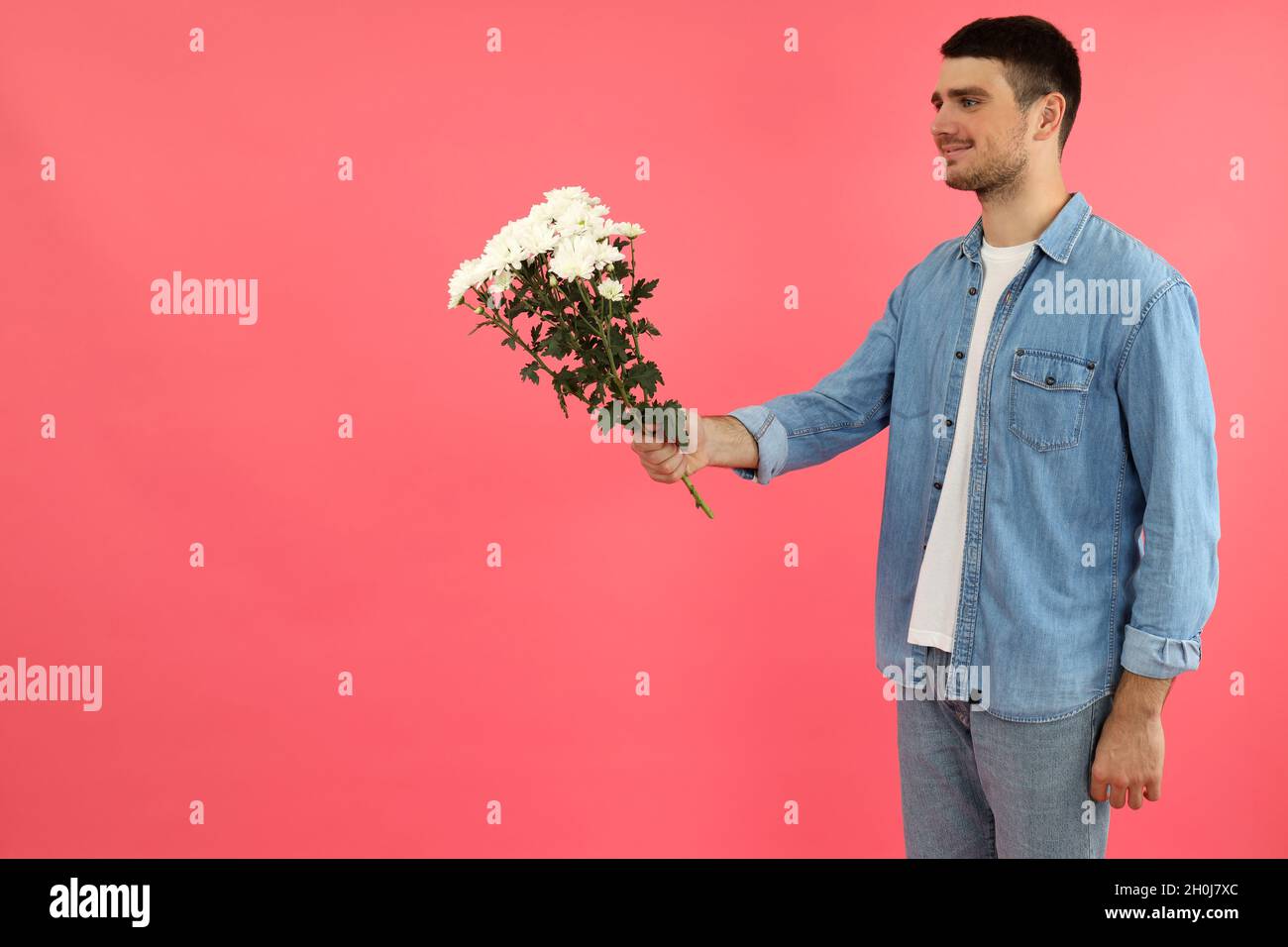 Young man give flowers hi-res stock photography and images - Alamy