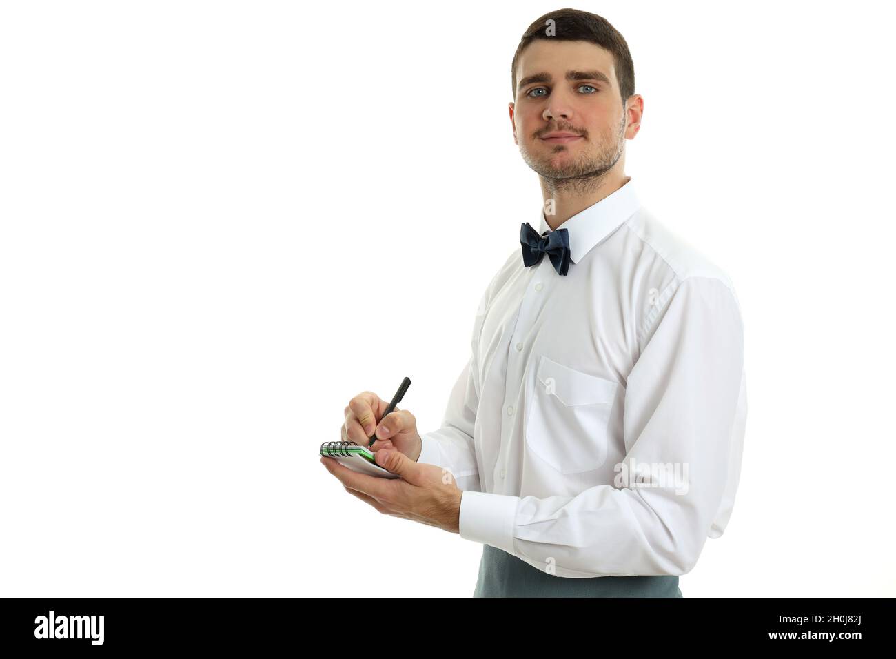 Young man waiter with notebook and pen, isolated on white background ...