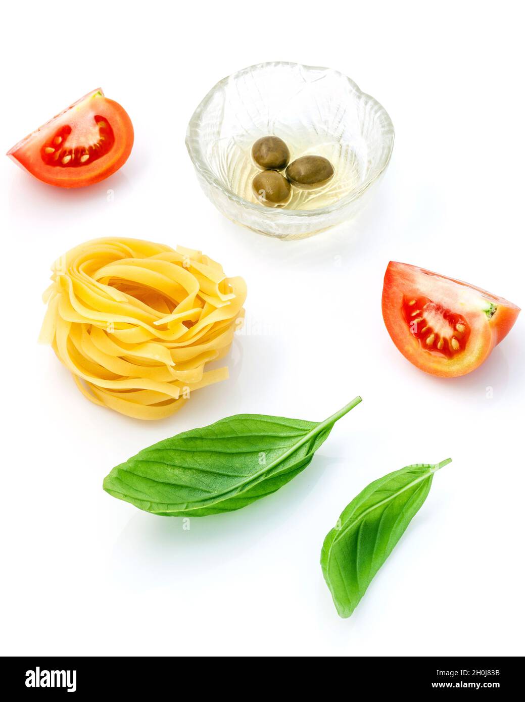 Italian food concept Fettuccine with tomato and sweet basil isolate on ...