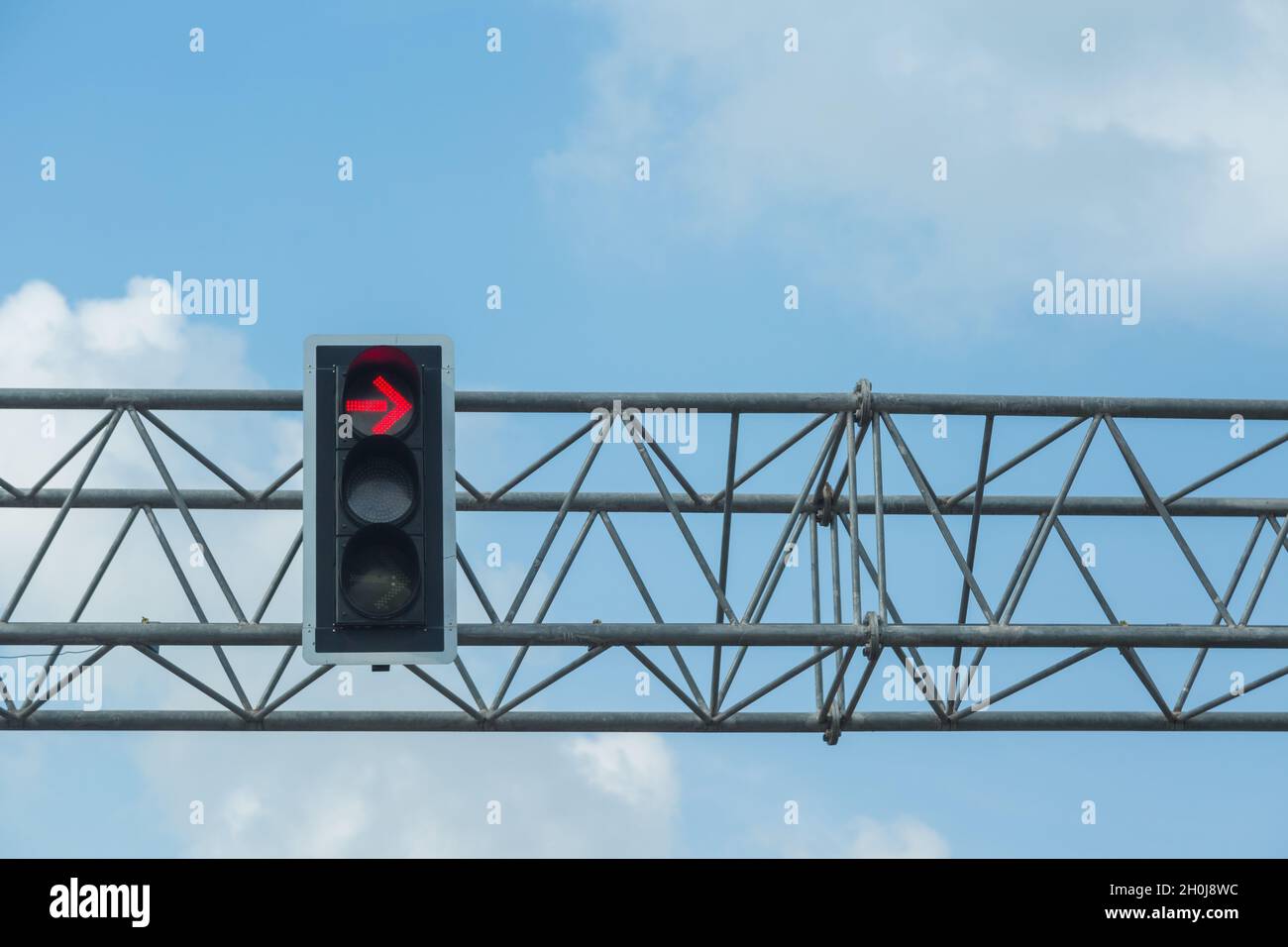 Red color turn left on the traffic light with blue sky background Stock ...