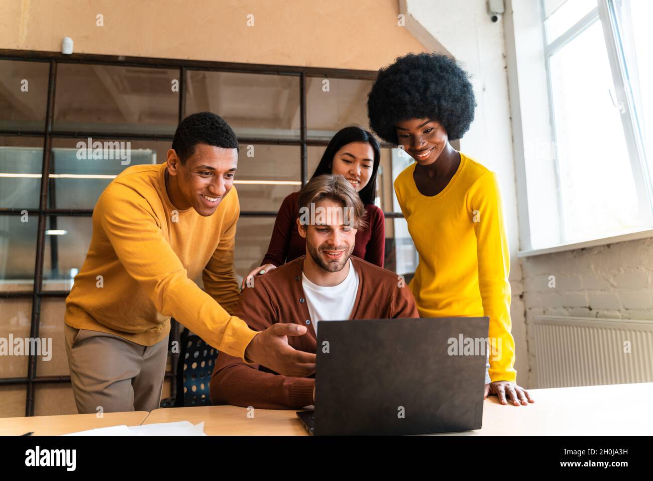 start up business team in the office. Employees at work on a new ...