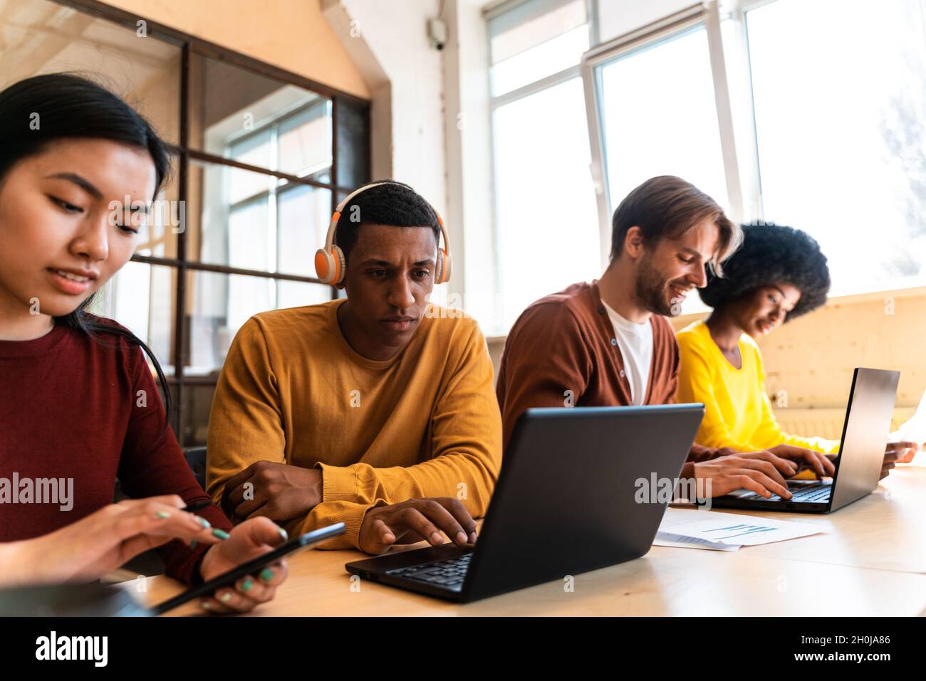 start up business team in the office. Employees at work on a new ...