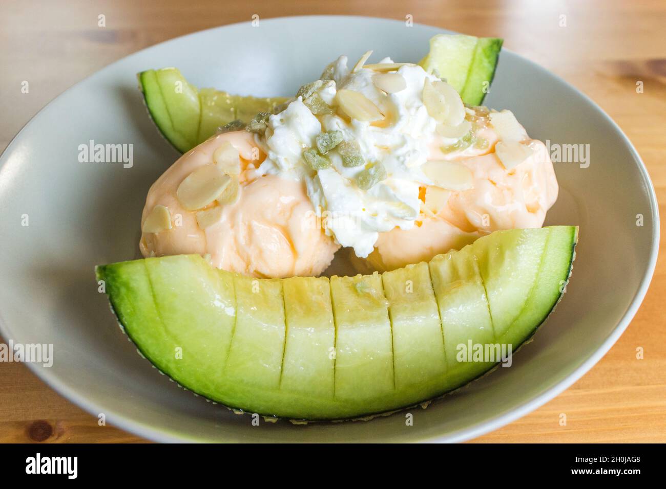 vanilla ice cream with melon piece Stock Photo - Alamy