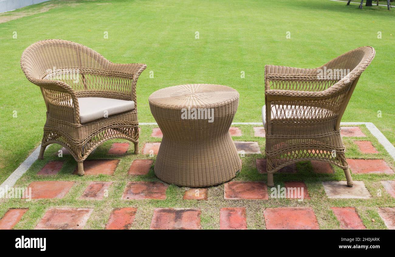Lounge area two chairs for guests outside with green grass Stock Photo ...