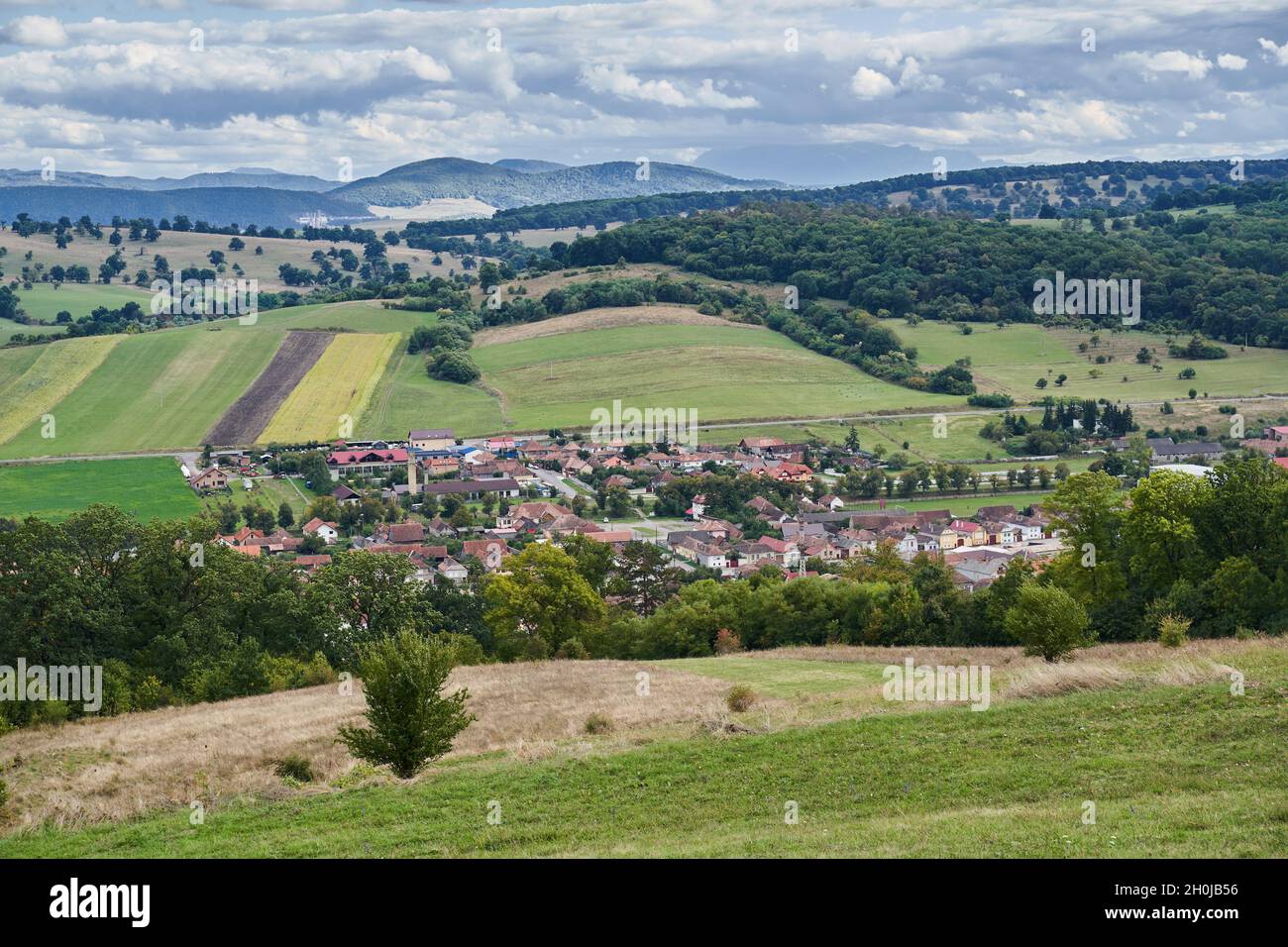 Aerial shot of an old village between hills Stock Photo - Alamy
