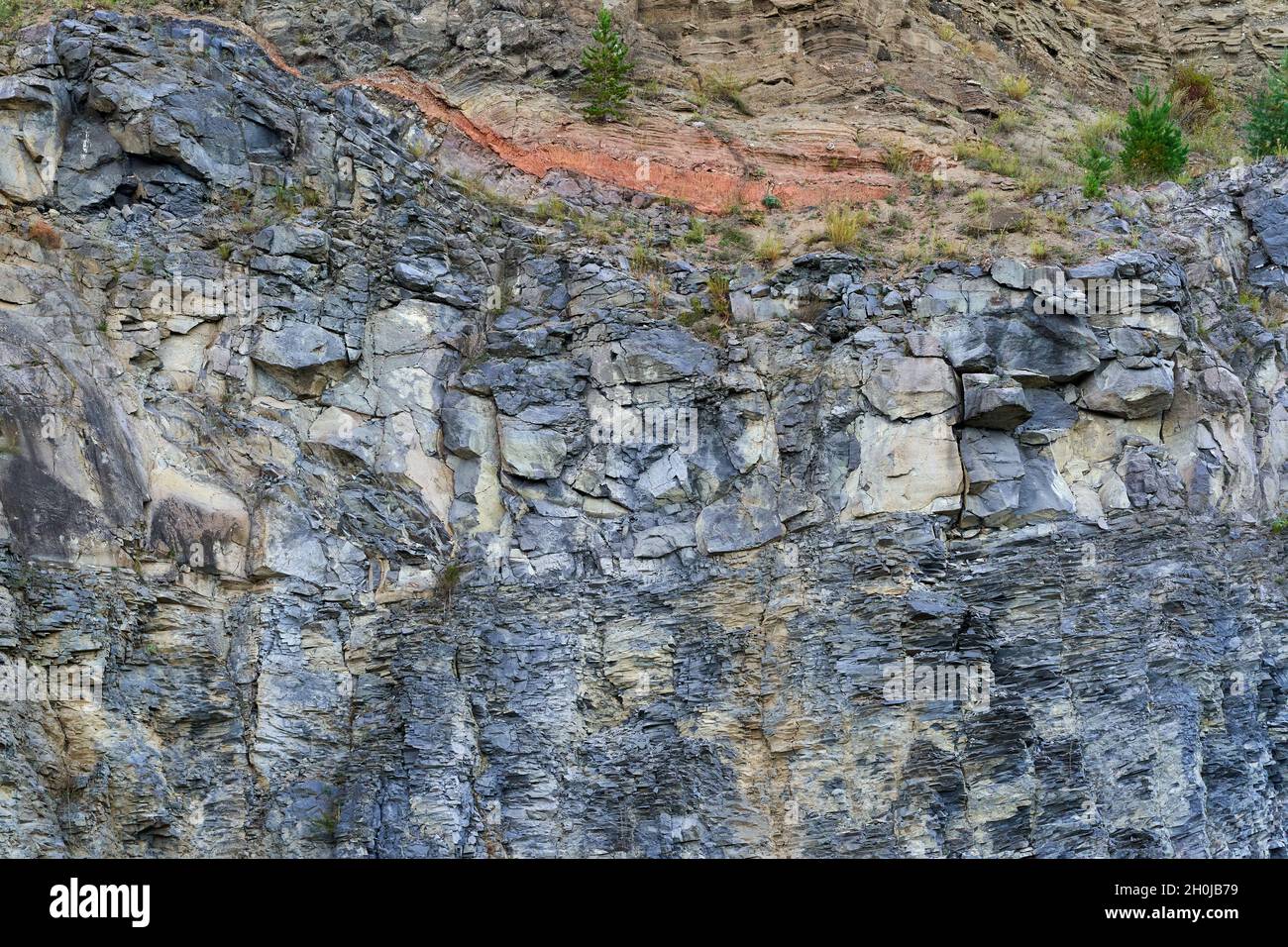 Various rock formation in geological layers in an abandoned quarry ...