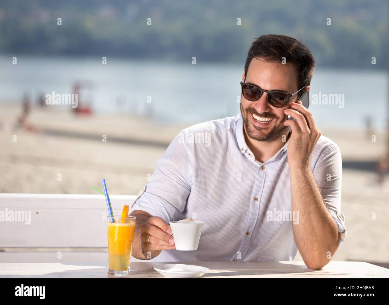 Man sitting in cafe hi-res stock photography and images - Alamy