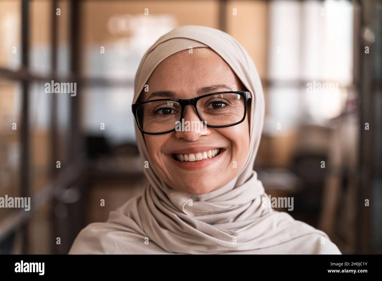 beautiful young woman with the hijab working in the office Stock Photo ...
