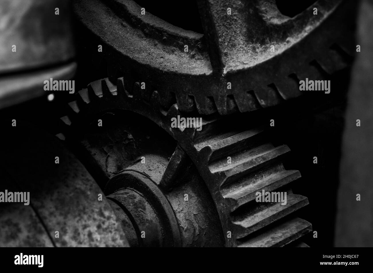 Grayscale closeup shot of large turning gears Stock Photo - Alamy