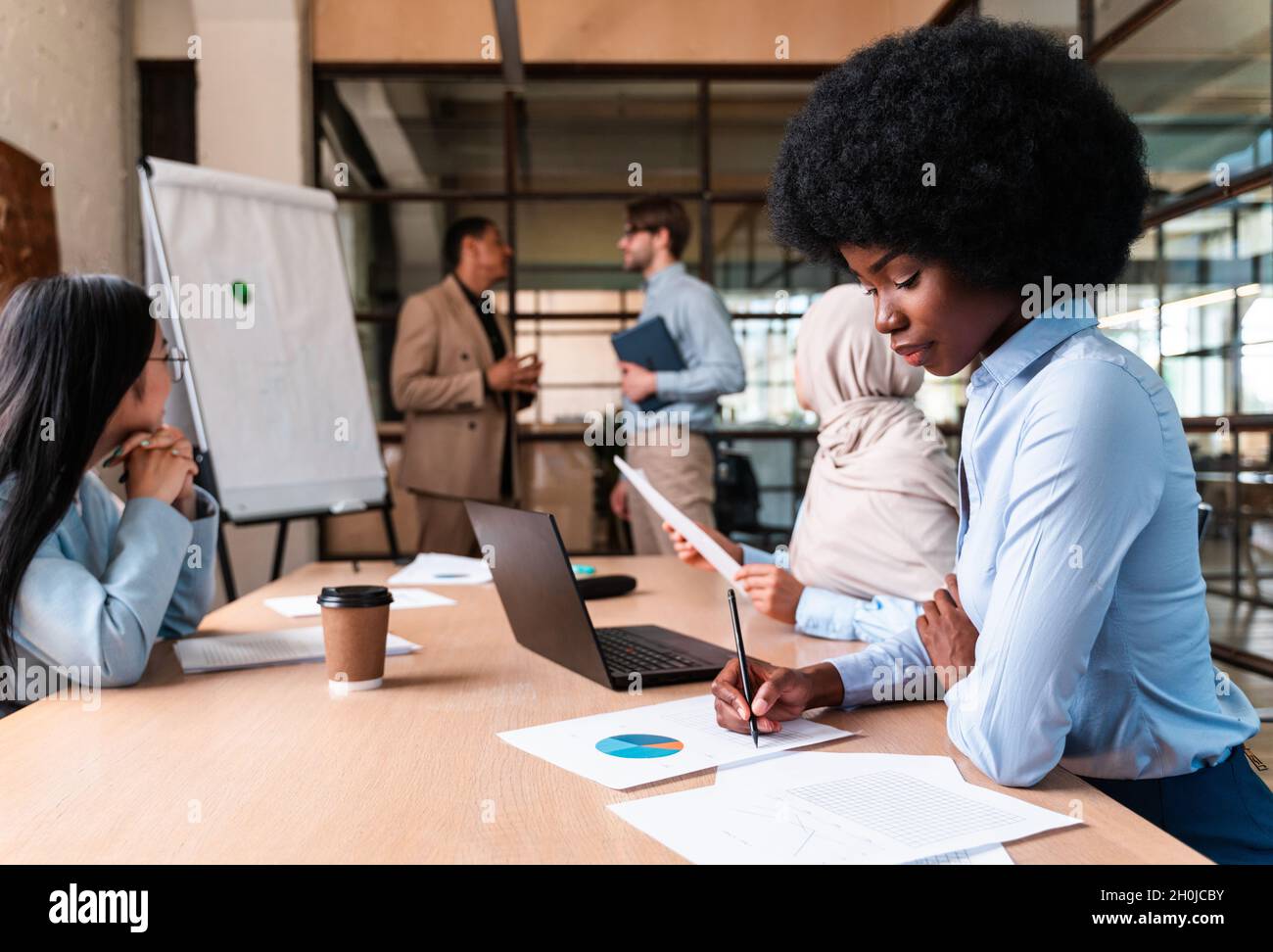 start up business team in the office. Multiethnic group working ...