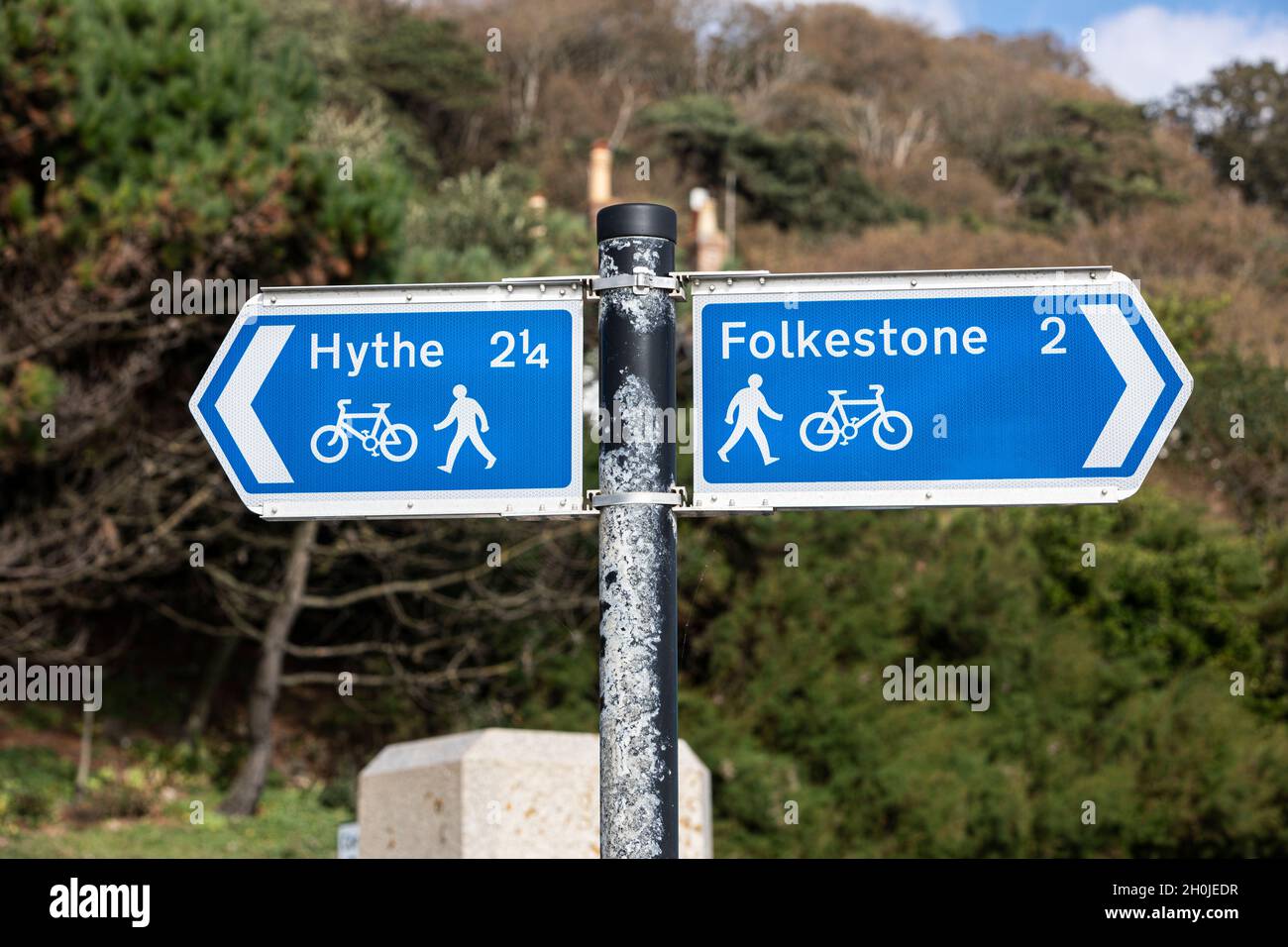 A sign showing the walking and cycle path along the coast from Hythe to ...