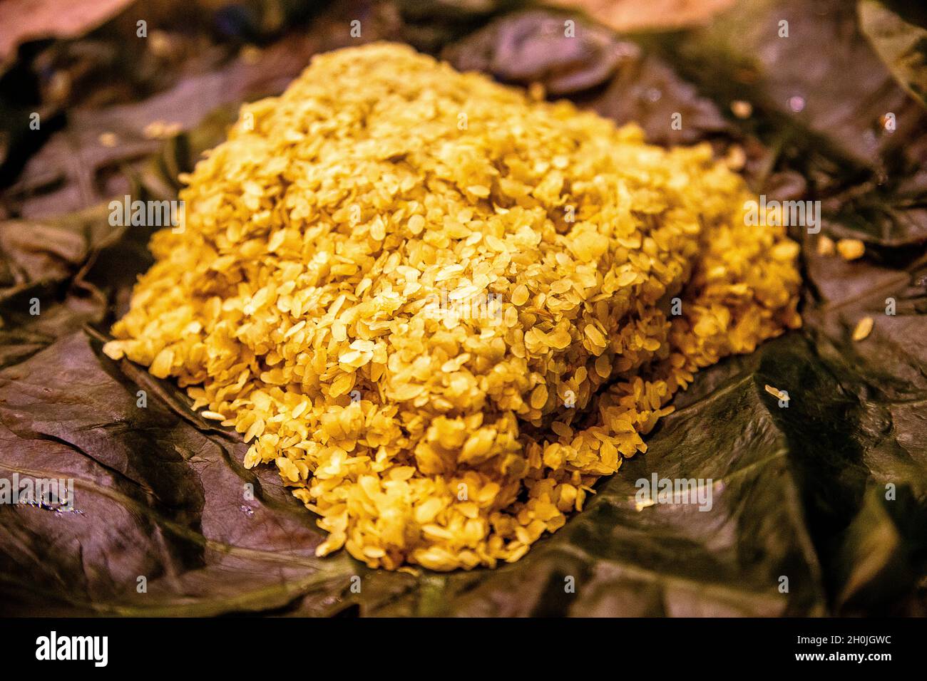 A pile of rice in a green leaf wrapper Stock Photo - Alamy