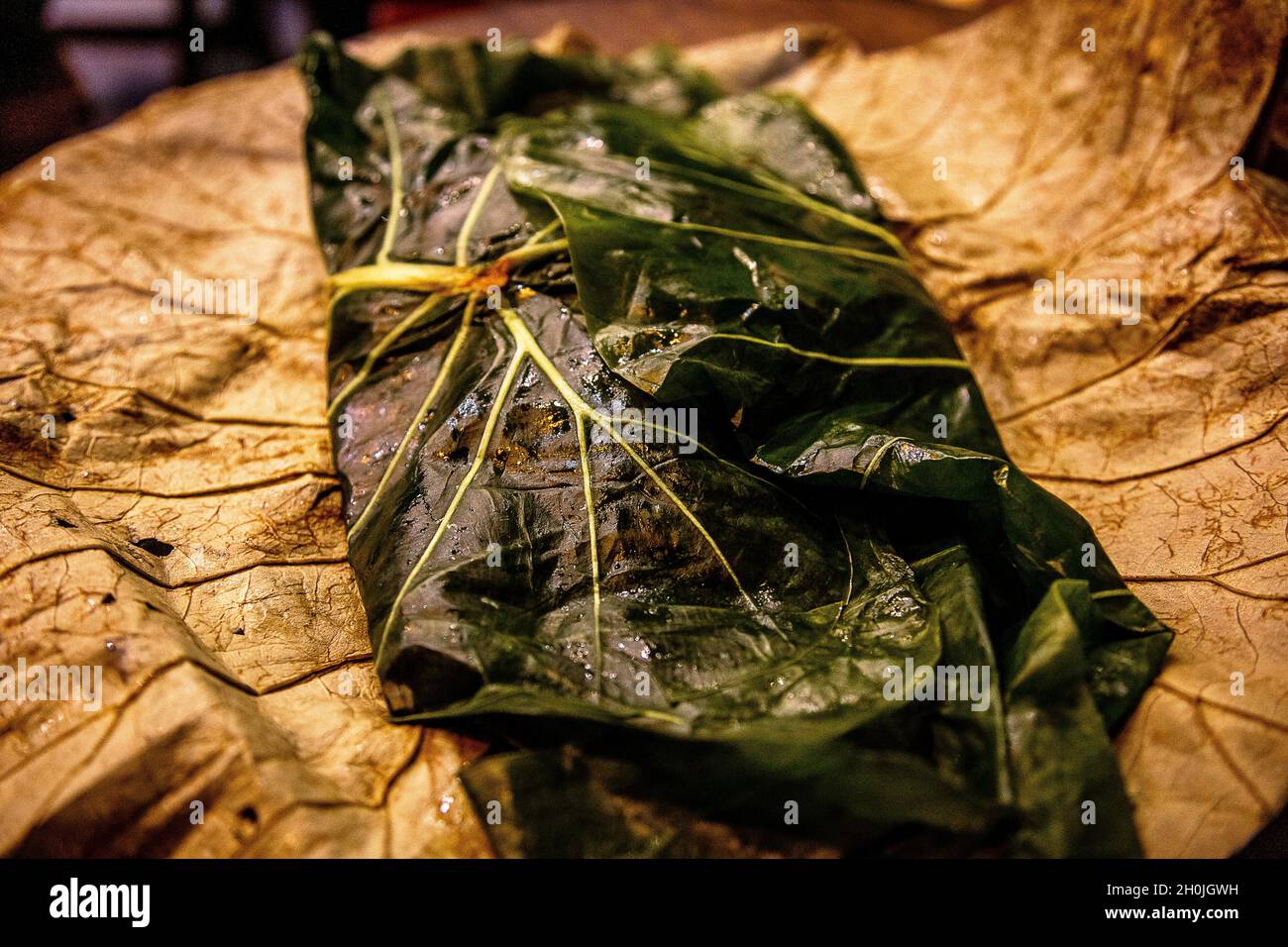 Rice is wrapped in a green leaf in Vietnam Stock Photo - Alamy