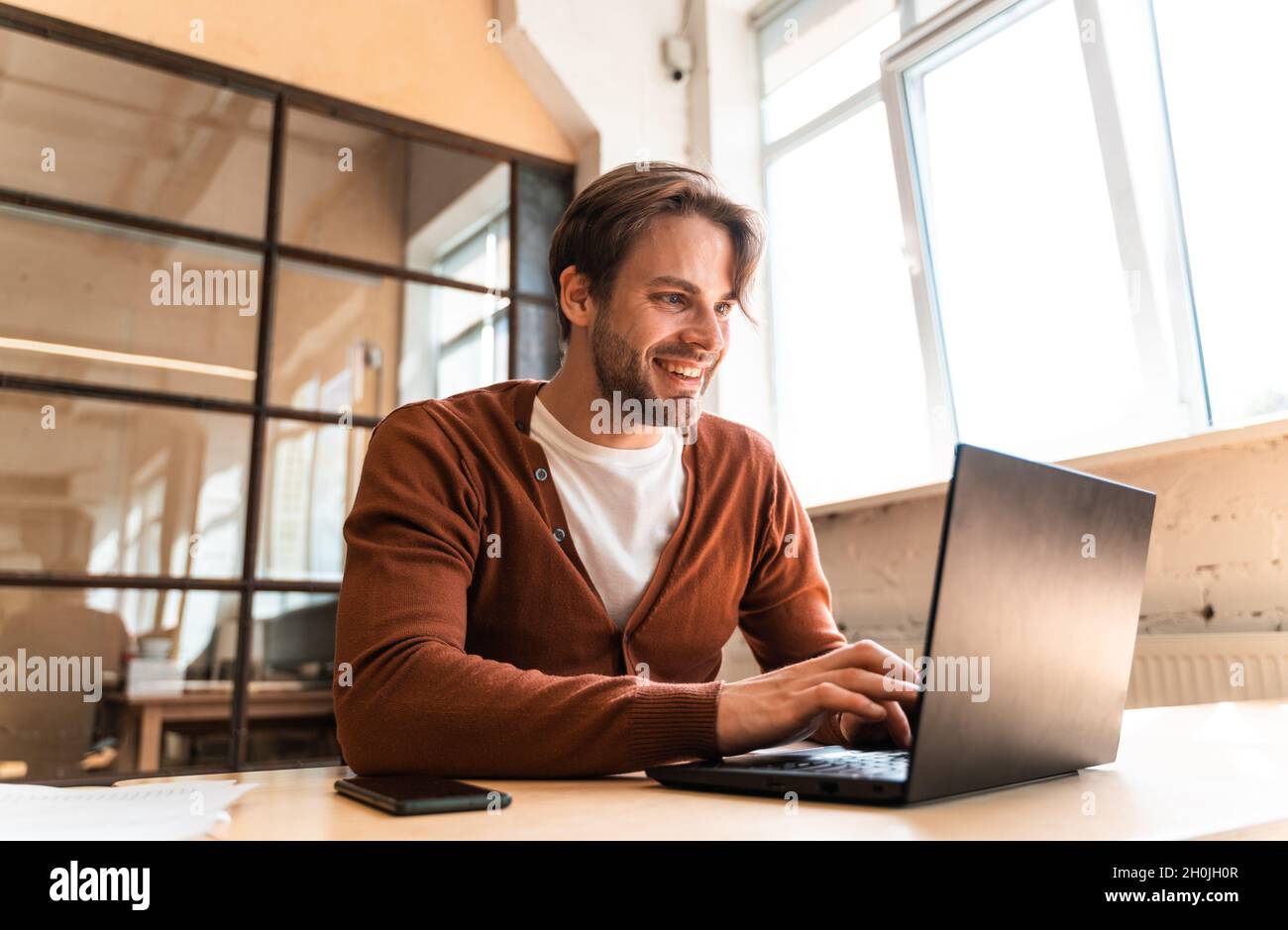 young business man working in the office. Start up employer sitting at ...
