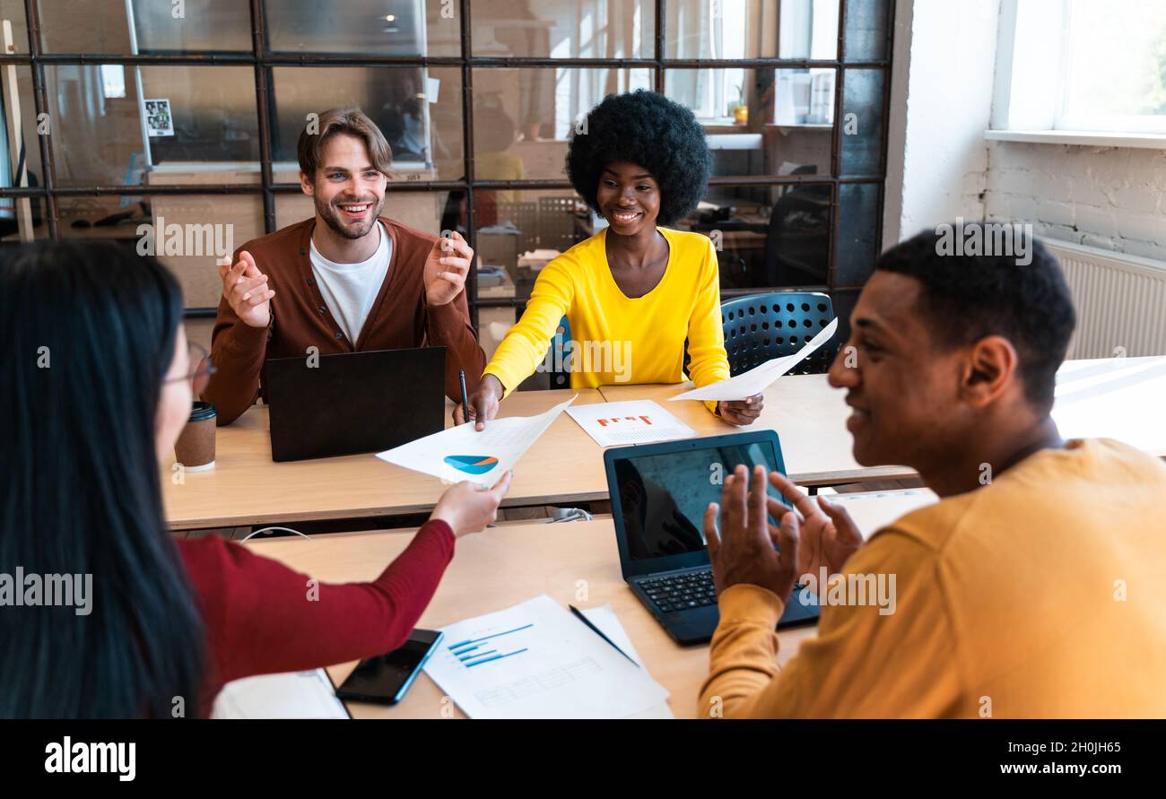 start up business team in the office. Employees at work on a new ...