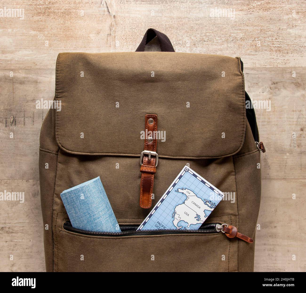 Arrangement with maps and backpack Stock Photo - Alamy