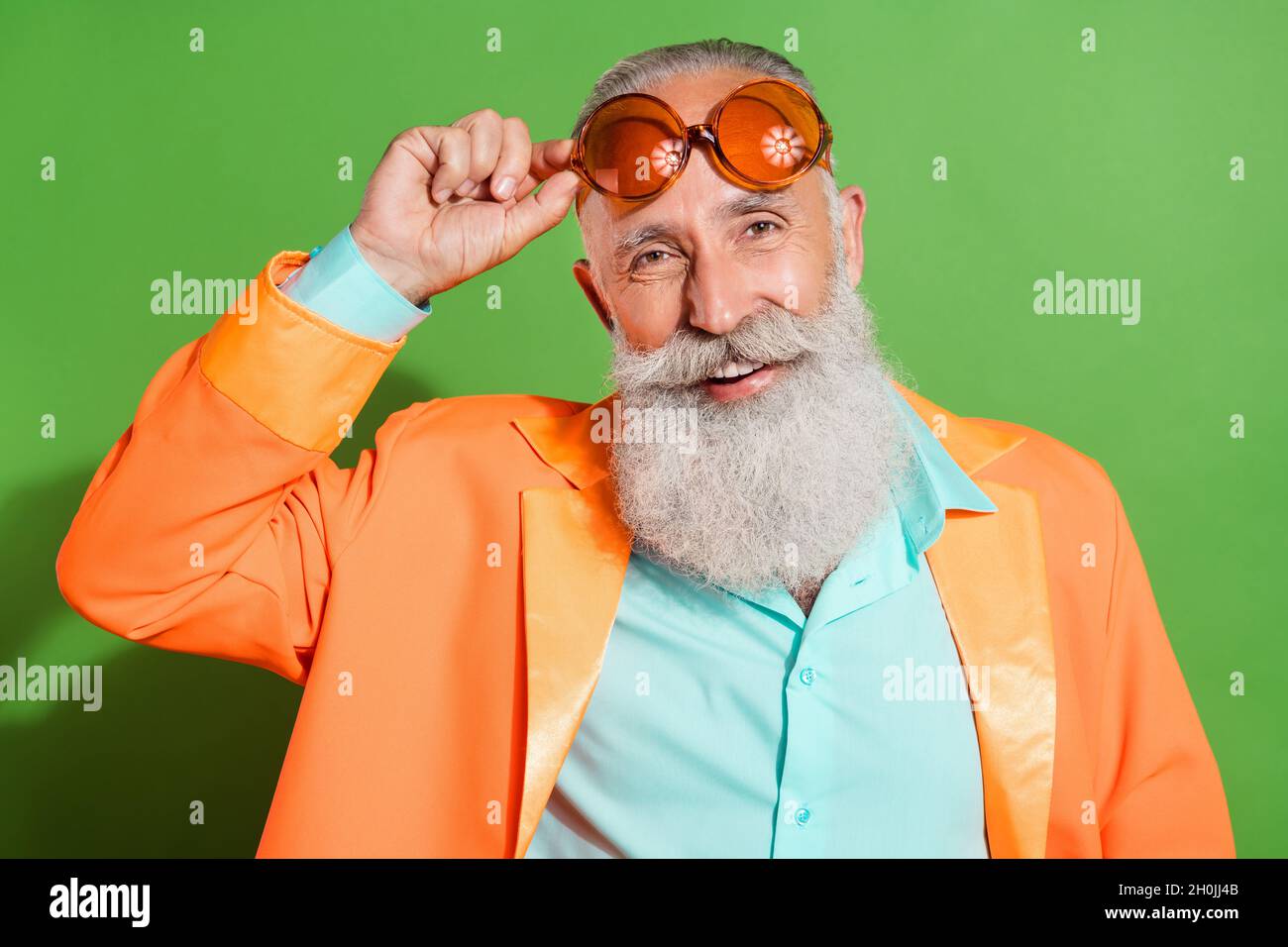 Portrait of attractive cheerful imposing man touching specs good mood ...