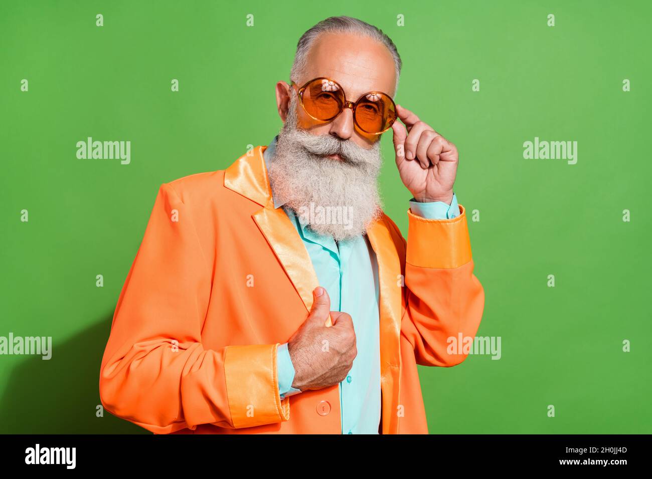 Portrait of attractive nice-looking imposing man touching specs posing ...